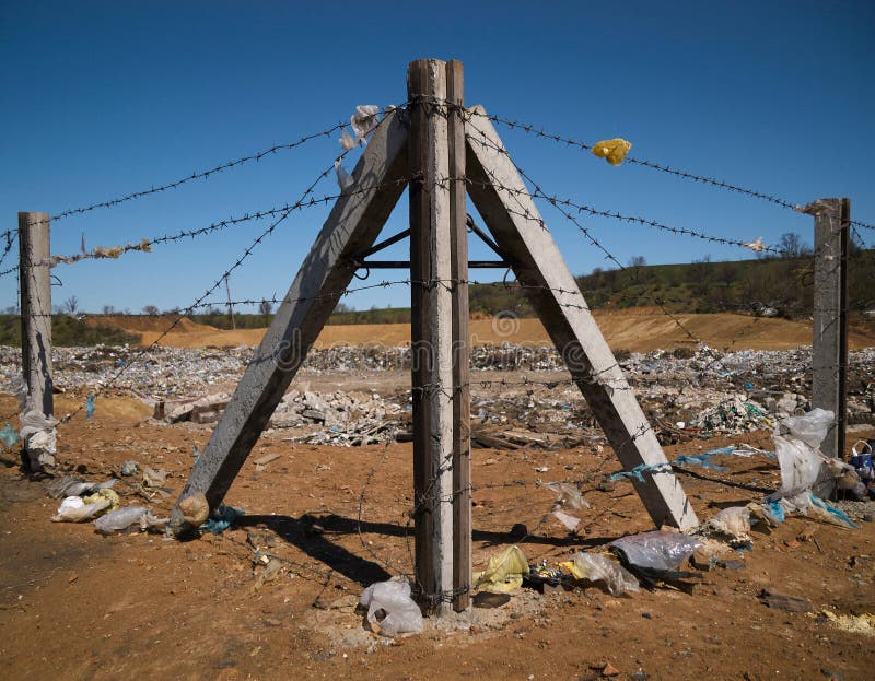 Fence of the garbage dump stock photo. Image of abandoned - 66117606