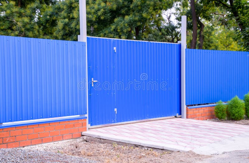 Fence and Gate from Sheets of Blue Metal Stock Image - Image of ...