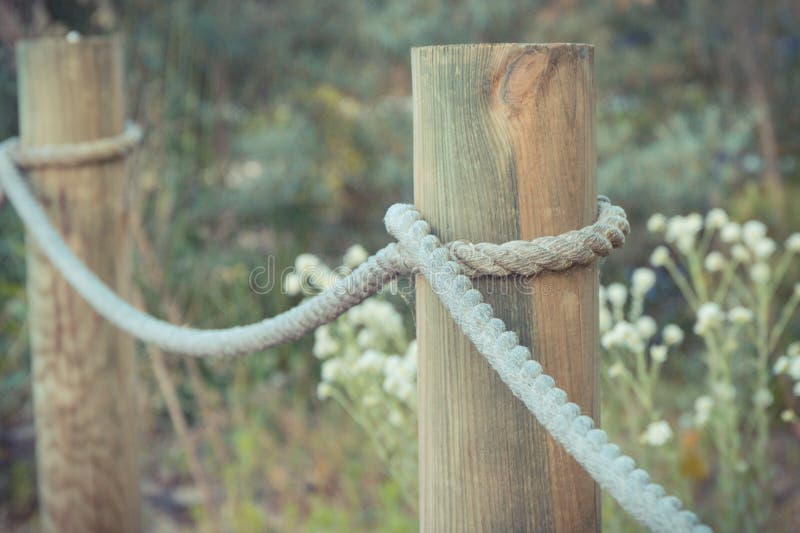 Closeup of Fence Made of Rope and Wooden Pole in Park Stock Photo ...