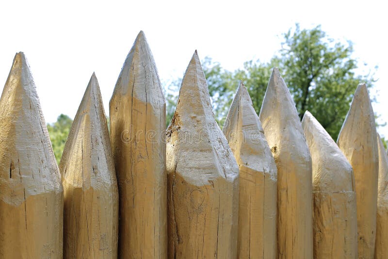 Fence Made of Sharpened Pointed Logs Stock Image - Image of trunks ...