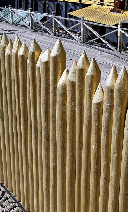 Fence Made of Sharpened Pointed Logs Stock Image - Image of trunks ...