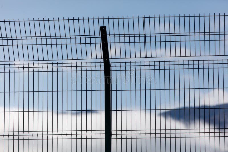 A Fence with a Metal Pole Sticking Out of it Stock Photo - Image of ...