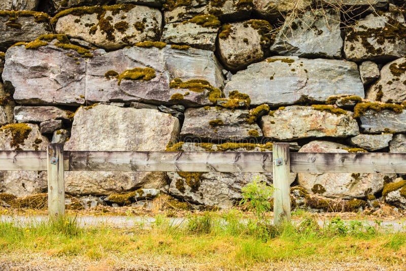 Fence and Narrow Path Along Wet Stone Wall Stock Photo - Image of fence ...
