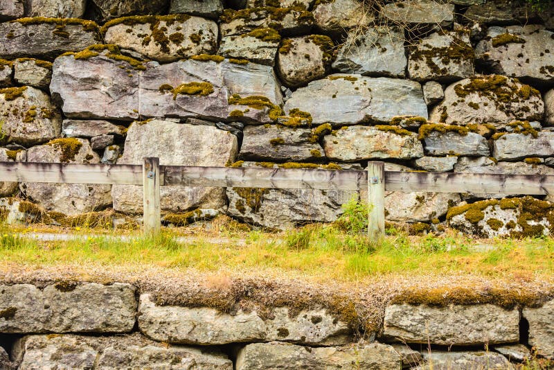 Fence and Narrow Path Along Wet Stone Wall Stock Photo - Image of ...