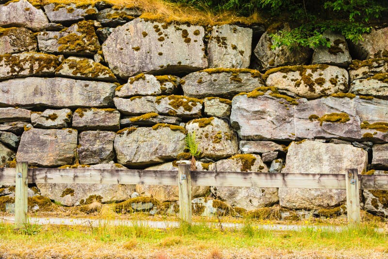 Fence and Narrow Path Along Wet Stone Wall Stock Photo - Image of ...