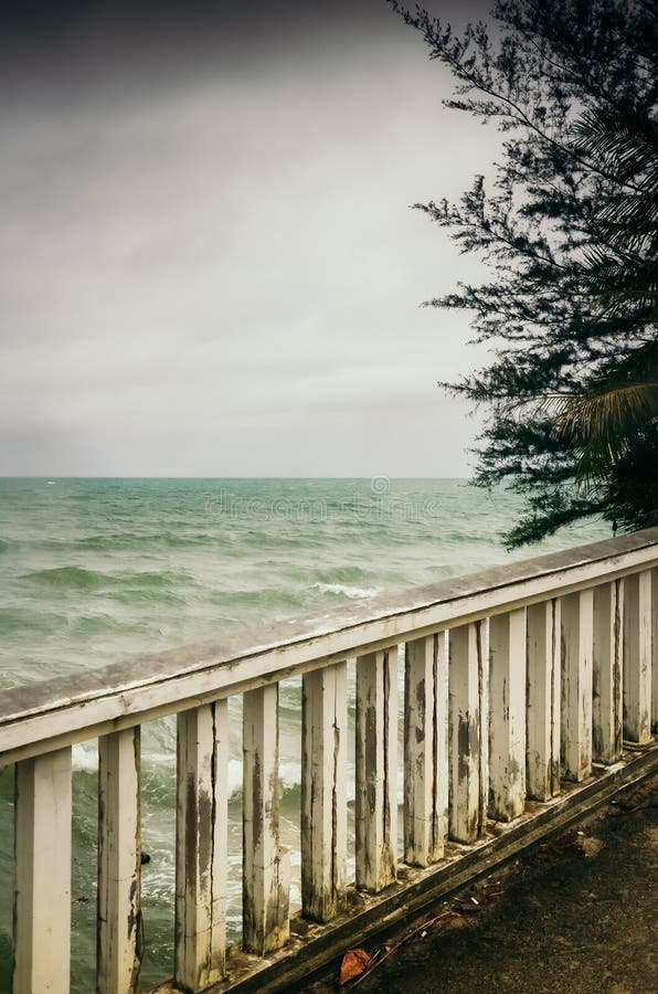 Fence with ocean behind stock image. Image of green, beach - 95068009
