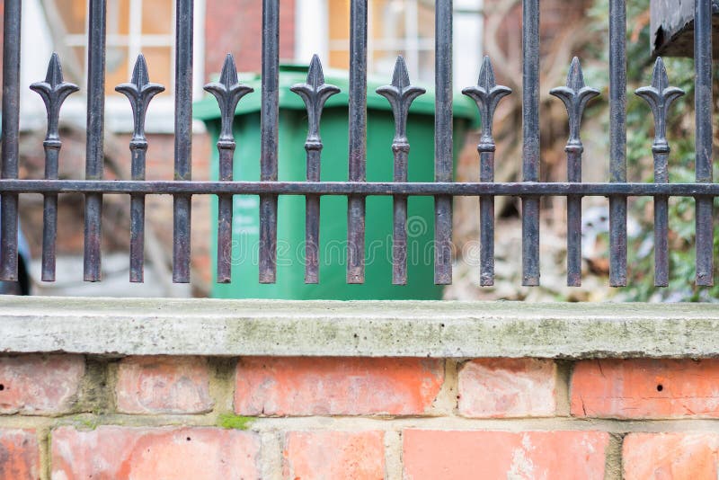 Fence over brick wall stock photo. Image of decoration - 85776838