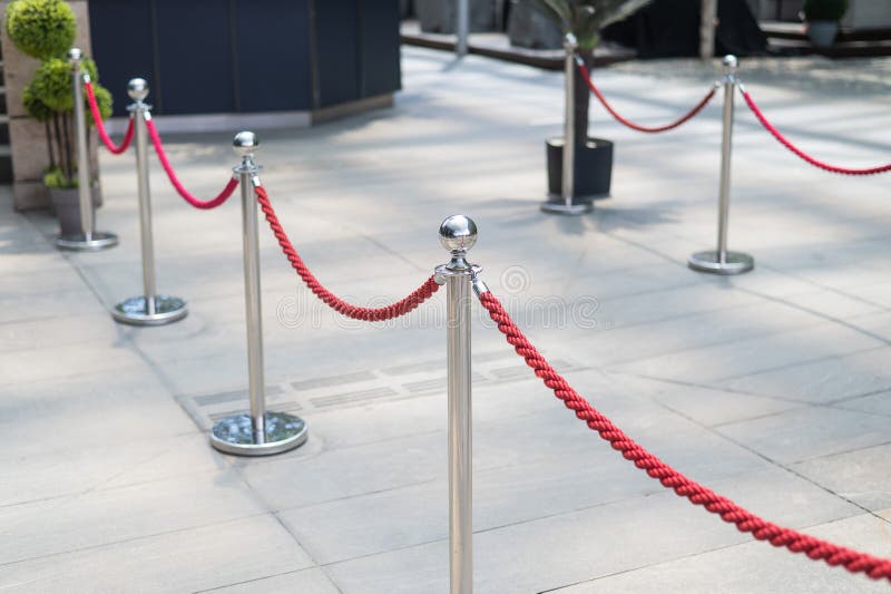 Fence posts with red rope. stock image. Image of festival - 291950661