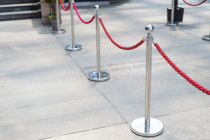 Fence posts with red rope. stock image. Image of fashion - 293430925