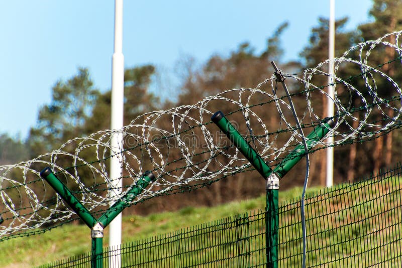 Fence with Razor Barbed Wire. Guarded Area. Military Base. Razor Wire ...