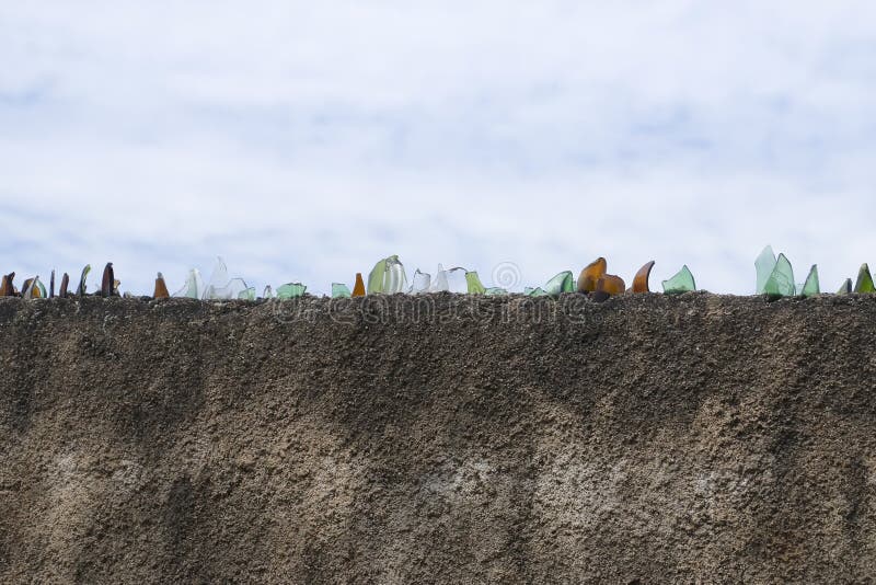 Shards of Glass on the Wall - Improvised Security Device Stock Photo ...