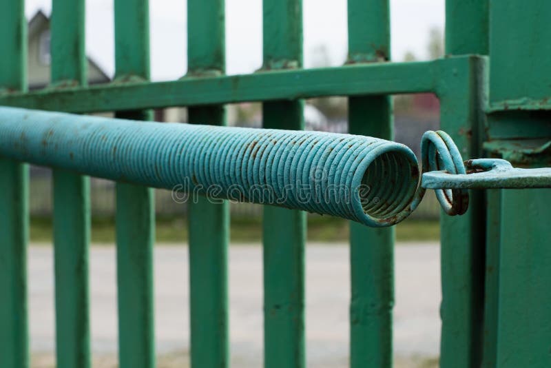 Fence with a spring stock photo. Image of mechanical - 94890308