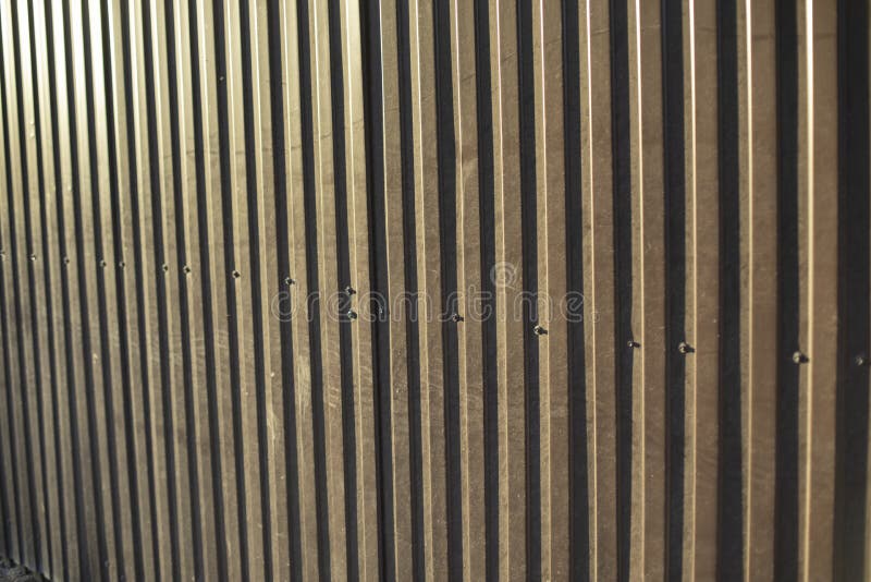 Fence in Sunlight. Steel Profile Fence Stock Image - Image of ...