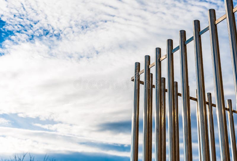 Fence with Tall Metal Bars Pointing To the Blue Sky with Perspective ...