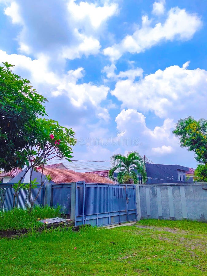 A Fence, Trees, Houses, and a Wonderfull Sky Stock Image - Image of ...