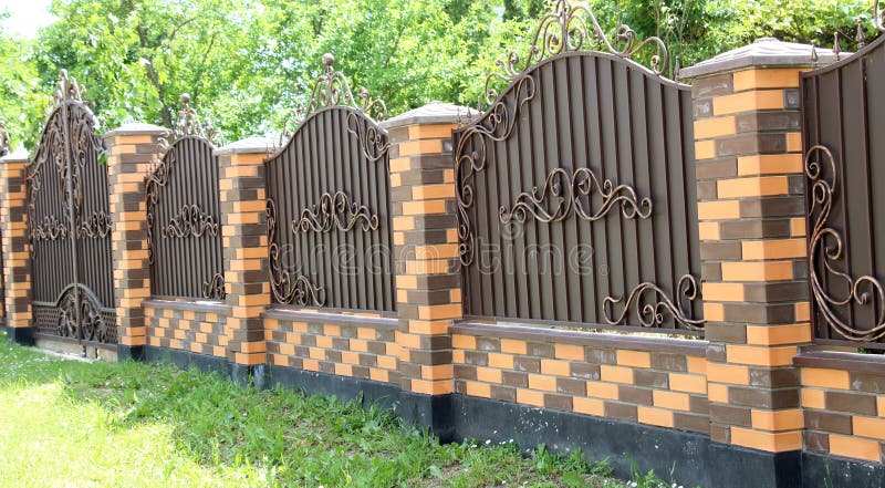 Fence Using Metal and Stone Stock Image - Image of building, gate ...
