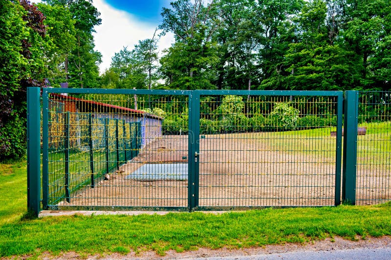 Fenced Area Green Mesh Metal Fence with a Gate Stock Image - Image of ...