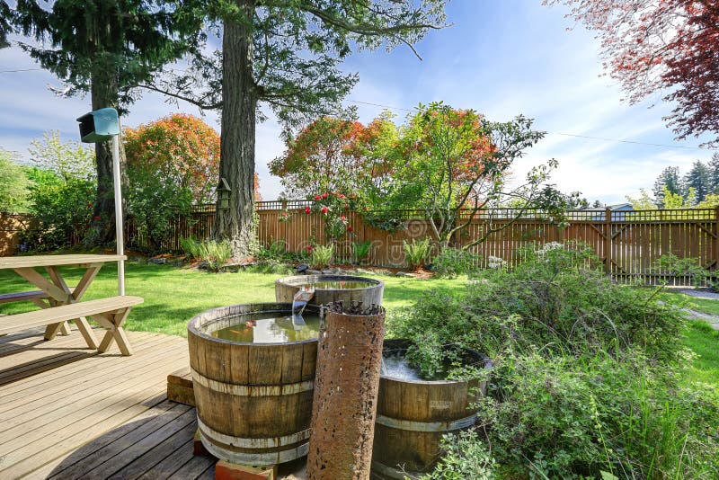 Fenced Back Yard with Patio Area and Beautifully Designed Pond Stock ...