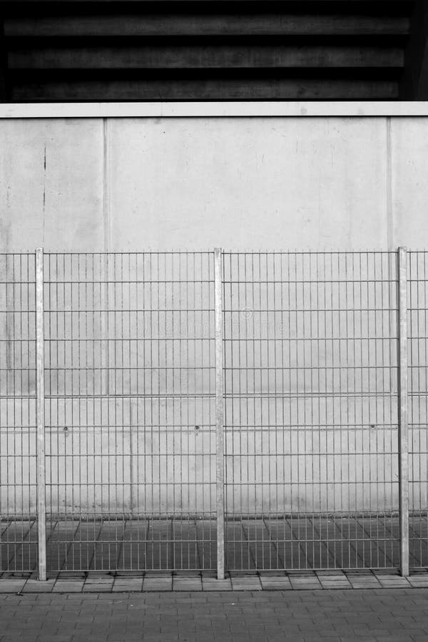 Fence in Front of Concrete Facade Stock Image - Image of fencing ...