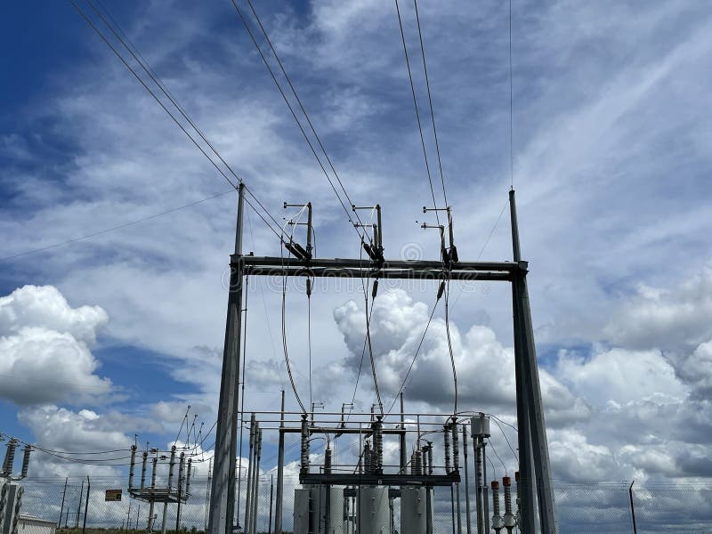 Fenced in Power Transformers and Tall Power Poles Front View Stock ...