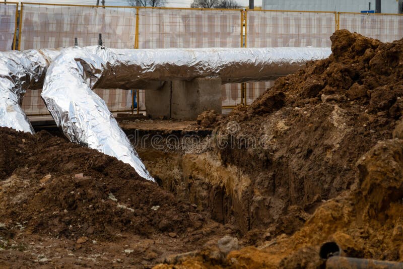 Trench and Pipes of the Heating System in Shiny Thermal Insulation ...