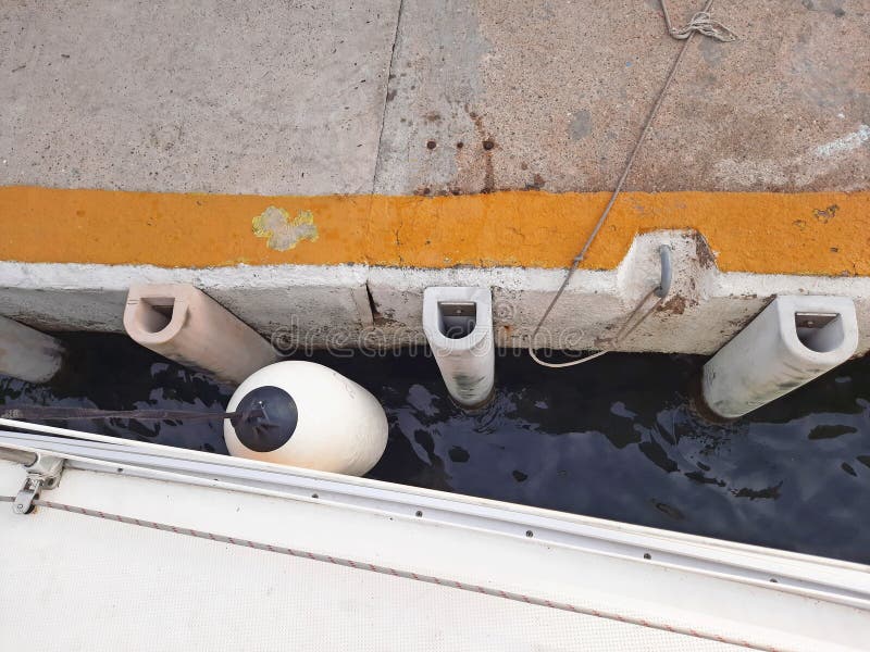 Fenders Suspended between a Boat and Dockside for Protection. Maritime ...