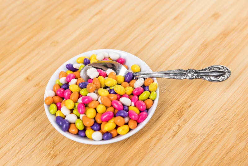 Fennel Seed Candy in a Bowl with a Spoon on a Wood Cutting Board Stock ...