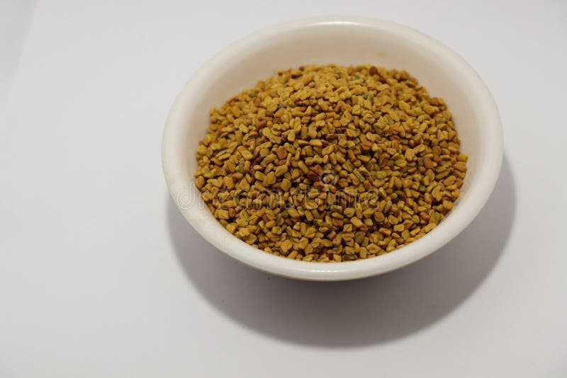 Fenugreek Methi Seed on the Bowl.in White Background. Stock Photo ...