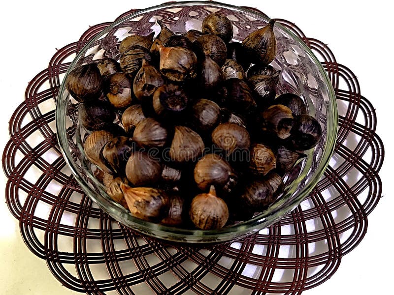 Fermented Black Garlic Tastes Sweet, Sour and Soft. Stock Photo - Image ...