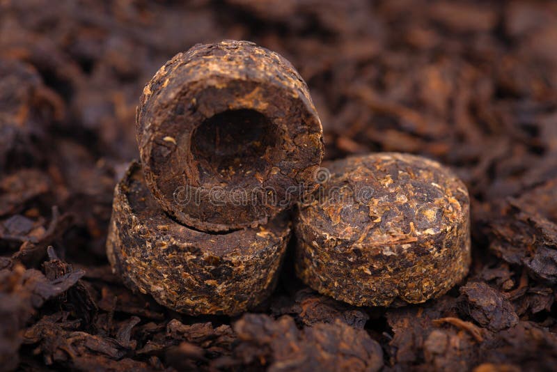 Fermented and Compressed Tea Leaves. Round Flat Disc of Puer Tea. Close ...