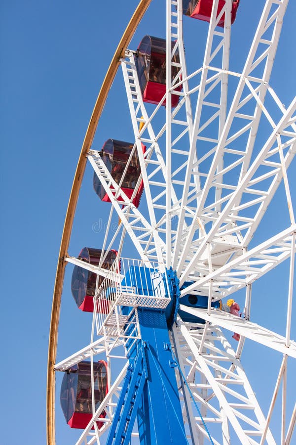 Ferris Wheel Against the Blue Sky, Close-up, Vertical Stock Photo ...