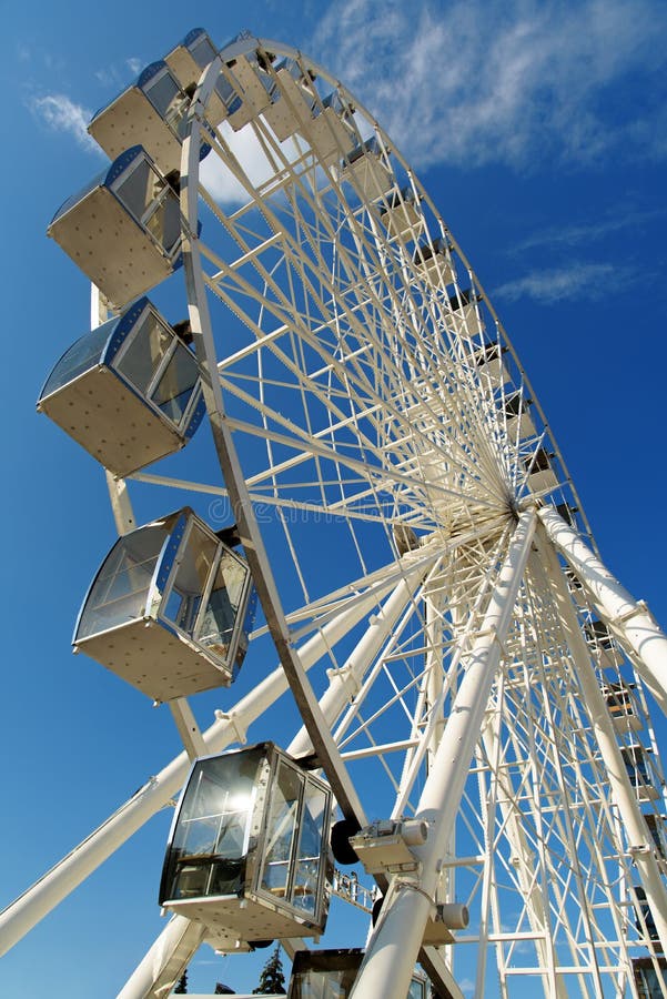 Ferris Wheel Against Blue Sky. Modern White Ferris Wheel Stock Image ...
