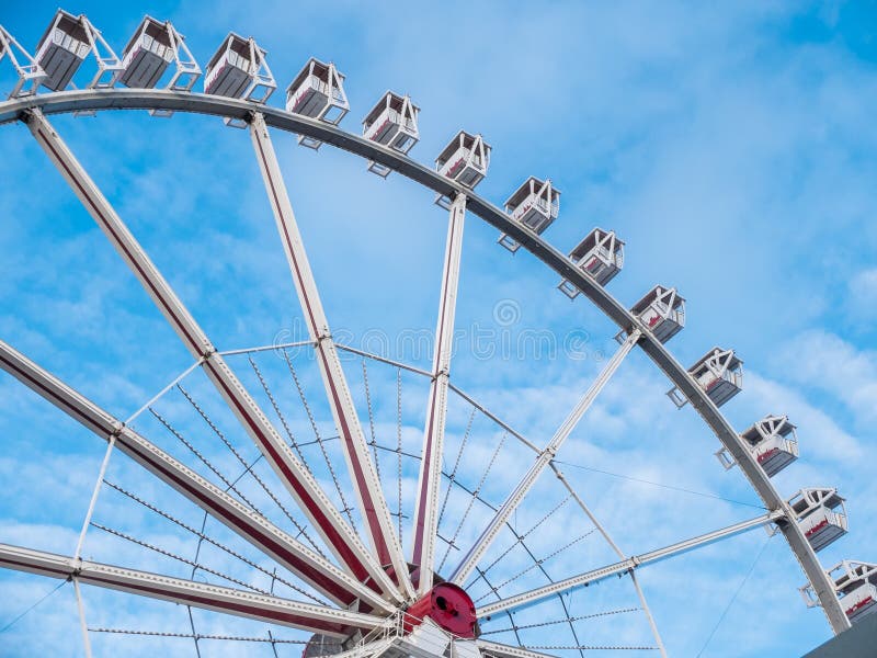 Ferris Wheel Against a Blue Sky Stock Image - Image of looking, fair ...