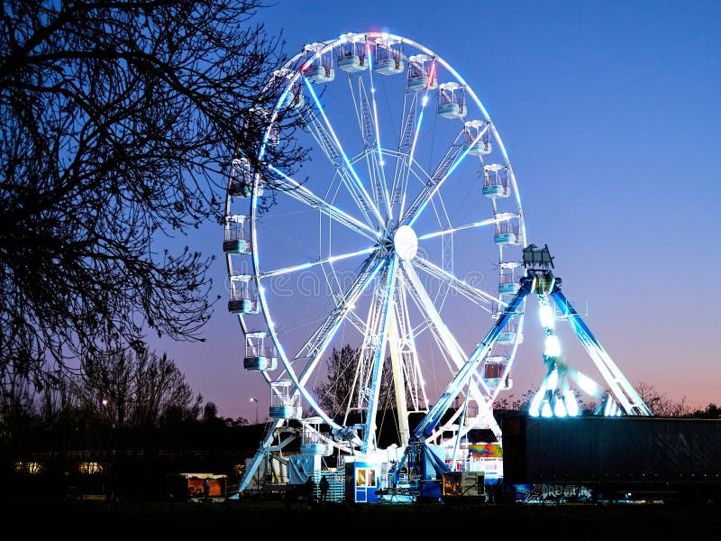 Ferris Wheel and Amusement Park at Dusk, at Night Editorial Photography ...