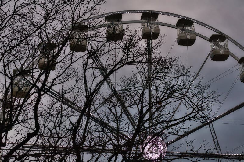 Ferris Wheel and Bare Trees Under an Overcast Sky in Harrogate, UK ...