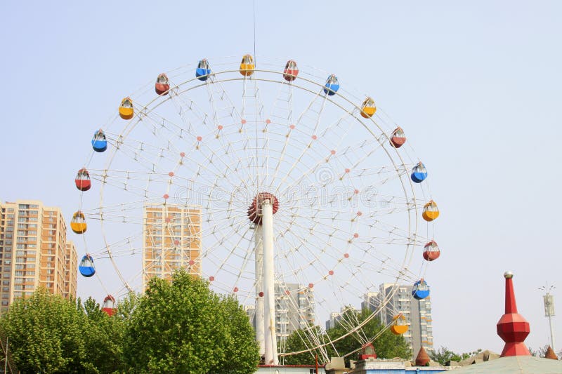 Ferris Wheel and Building in a Park Stock Photo - Image of shijiazhuang ...
