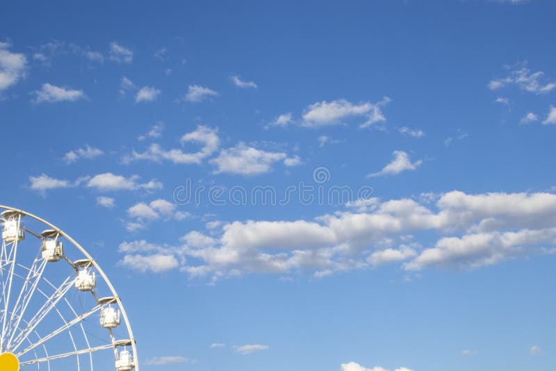 Ferris Wheel Cabins Against the Blue Sky in an Amusement Park. an Image ...