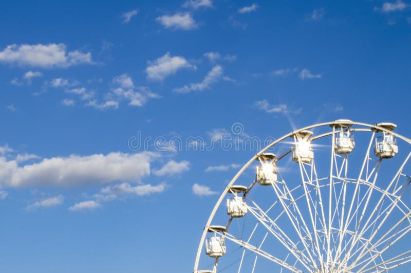 Ferris Wheel Cabins Against the Blue Sky in an Amusement Park. an Image ...