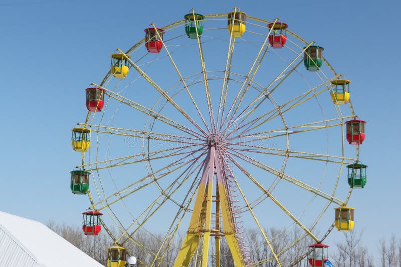 Ferris Wheel with Color Cabins Against the Blue Sky Stock Image - Image ...