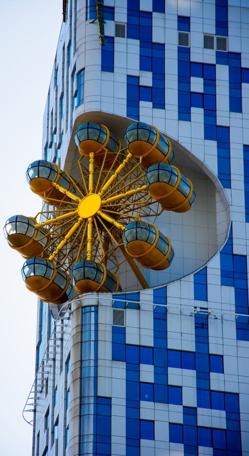 The Ferris Wheel Inserted in the Building As an Ornament Editorial ...