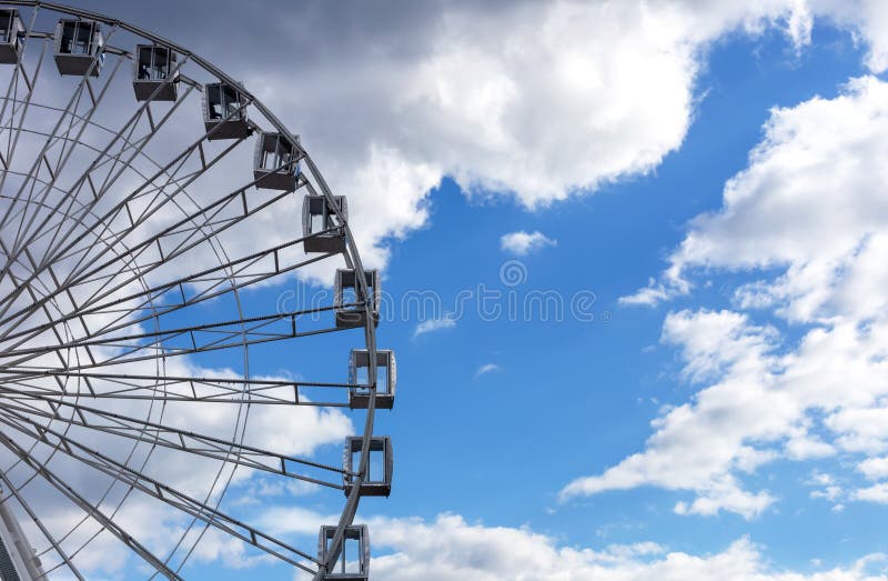 Ferris Wheel and Light Blue Sky with White Clouds Stock Photo - Image ...