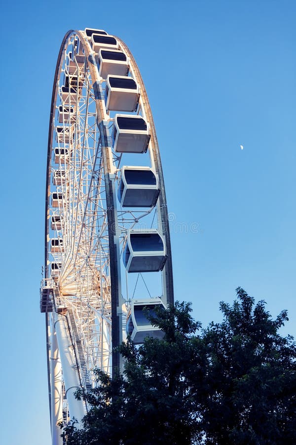 Ferris Wheel and Moon on a Blue Sky Background Stock Photo - Image of ...