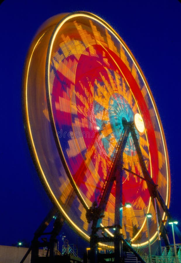 Ferris Wheel in Motion stock photo. Image of nightlife - 66653430