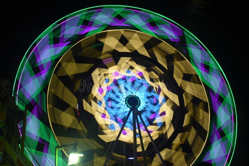 Ferris Wheel in Motion Making Unique Light Pattern. Shot in Long ...