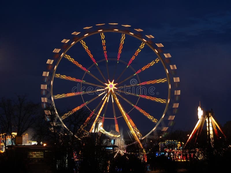 Ferris wheel at night stock photo. Image of motion, chair - 690578