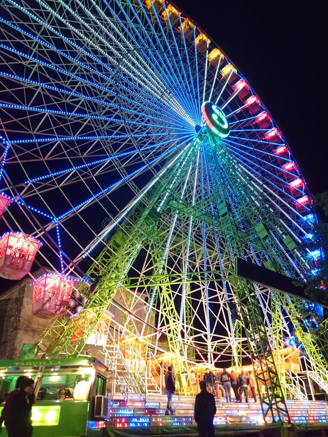 Carnival and Ferris Wheel at Night - Bright Lights and Long Exposure ...