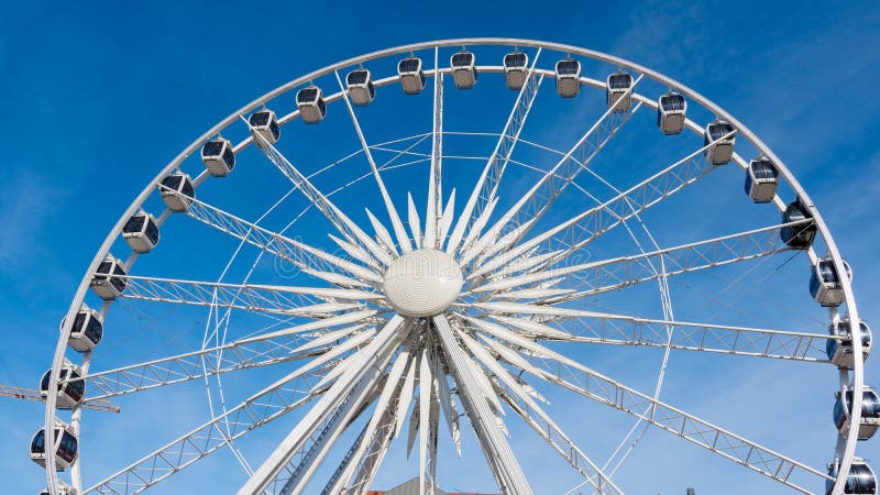 Ferris Wheel Rotating on Blue Sky Background. Stock Photo - Image of ...