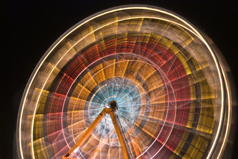 Ferris Wheel Spinning Colors Stock Image - Image of gold, kids: 2869955