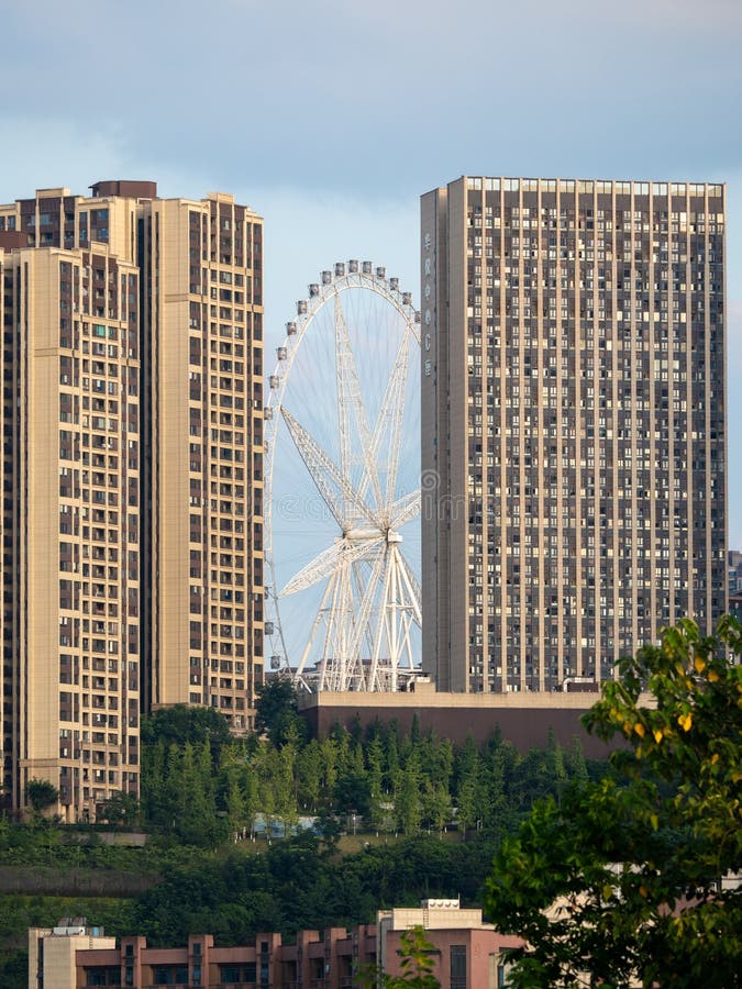 Ferris wheel and buildings stock photo. Image of engineering - 327411280