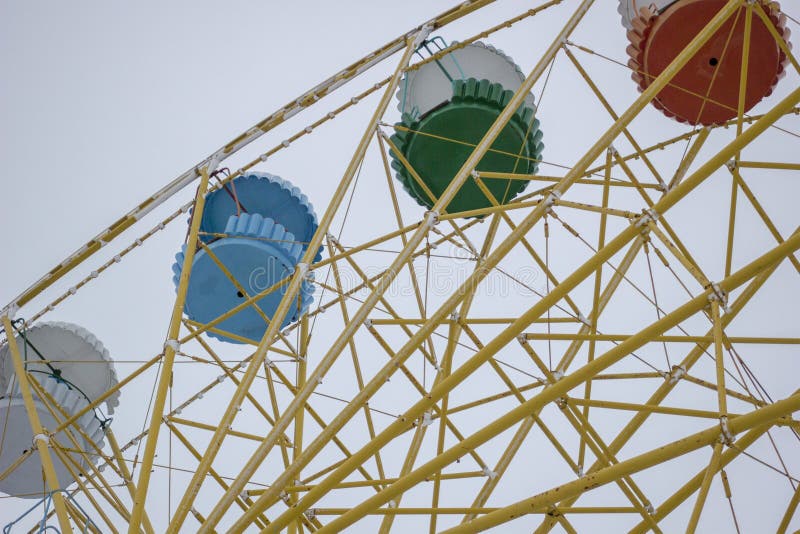 Ferris Wheel-yellow with Multi-colored Booths Stock Photo - Image of ...